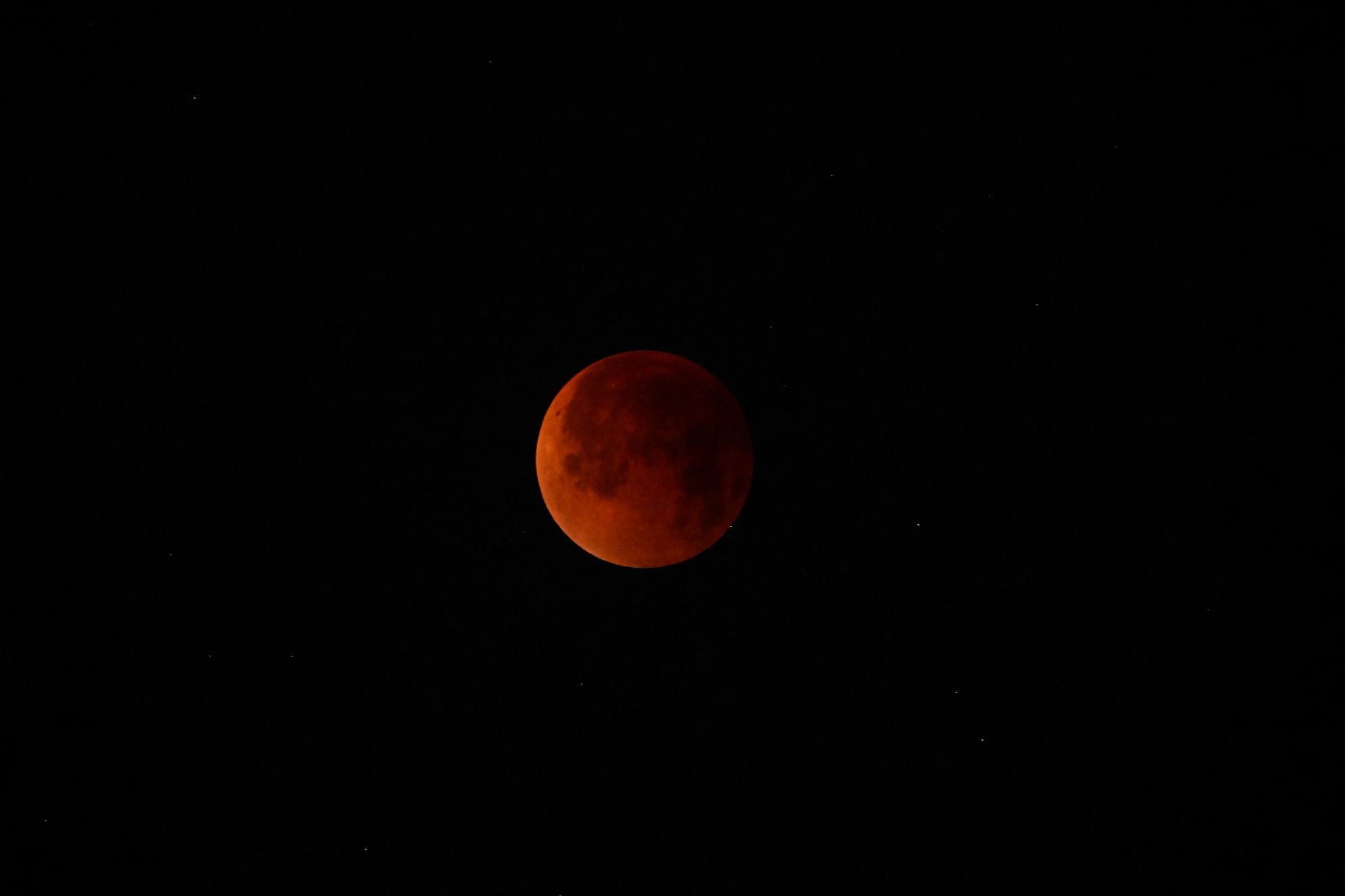 Lunar eclipse in pictures: Blood moon mesmerises skywatchers worldwide