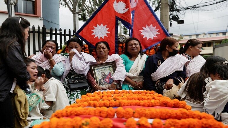 Weeping Nepalis hold funerals for those killed in deadly anti-graft ...