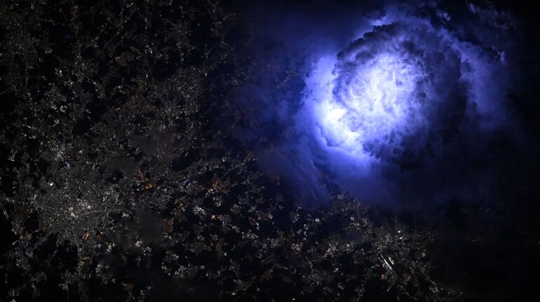 Nasa astronaut captures eerie purple lightning buzzing across Earth ...