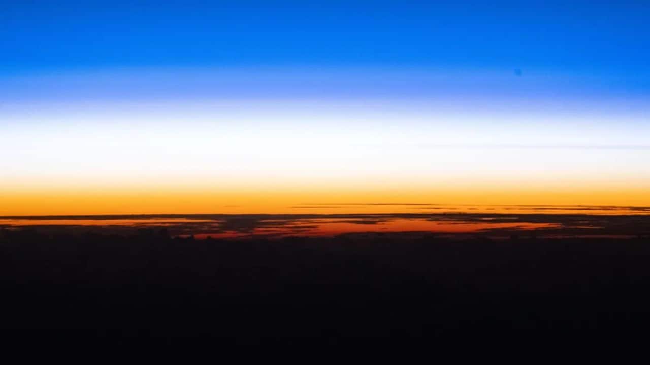 Astronaut captures stunning sunset from space with golden cosmic horizons