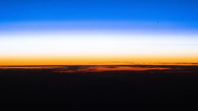 Astronaut captures stunning sunset from space with golden cosmic horizons