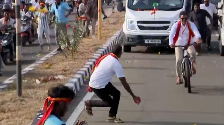 TVK chief Vijay leaps off bicycle at Kanyakumari rally as flower ball ...