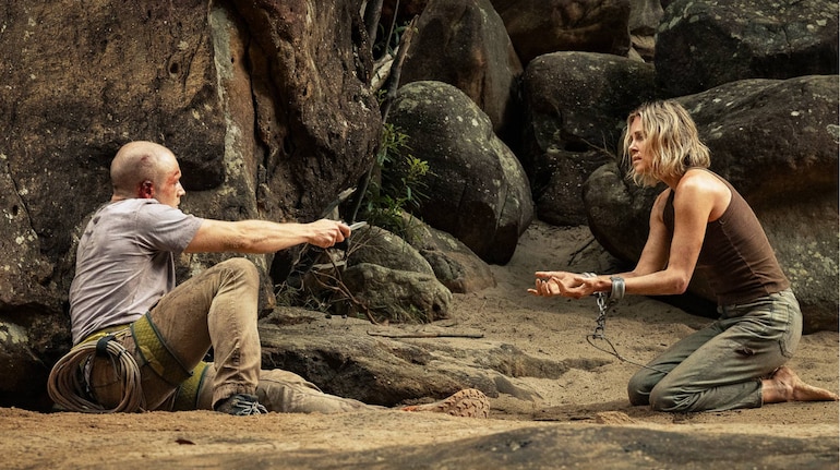 Apex Movie Review: Charlize Theron brings the grit; Taron Egerton ...