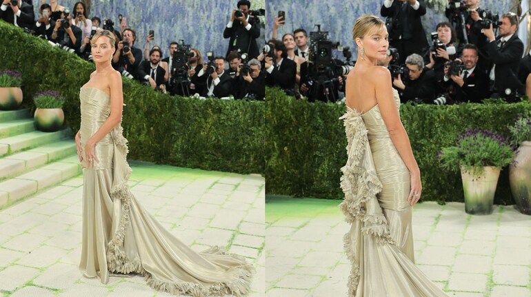 Margot Robbie returns to Met Gala in intricately embroidered gold ...
