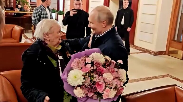 Watch: Putin’s flower-filled reunion with former teacher ignites social ...