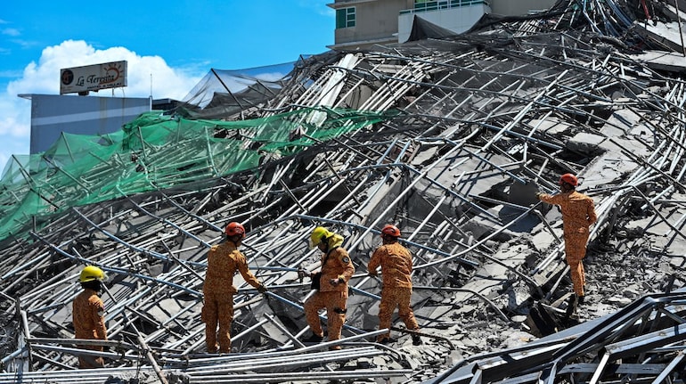 At least one dead in Philippine building collapse, 21 people missing