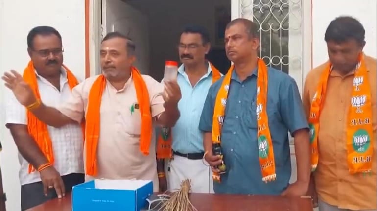 Karnataka BJP workers kill cockroaches during protest against Cockroach ...