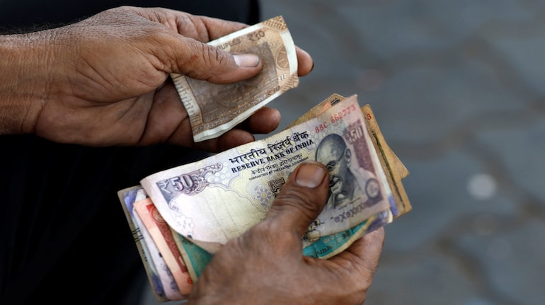 Rupee hits five-week high after oil plunges; traders eye further rally