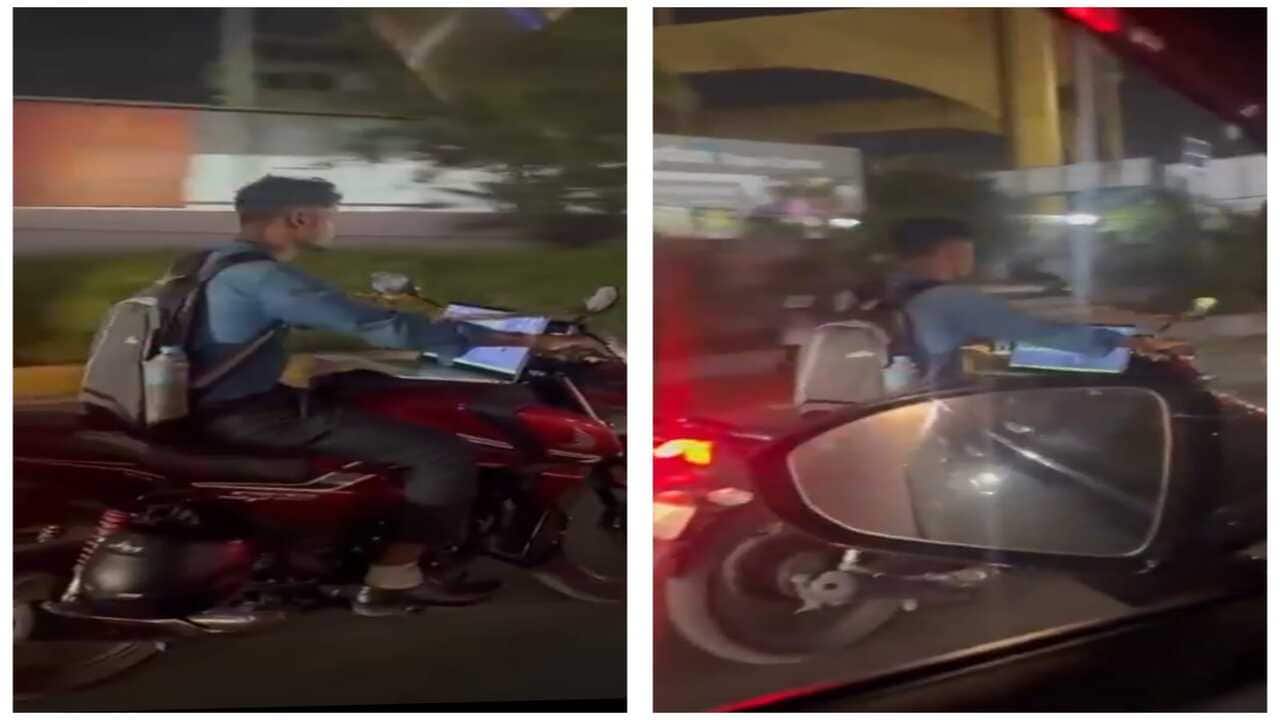 Hyderabad man rides bike with laptop open on fuel tank, viral video ...
