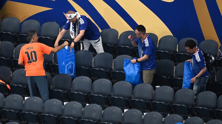 Japan fans use blue bags to uphold cleansing FIFA World Cup tradition ...