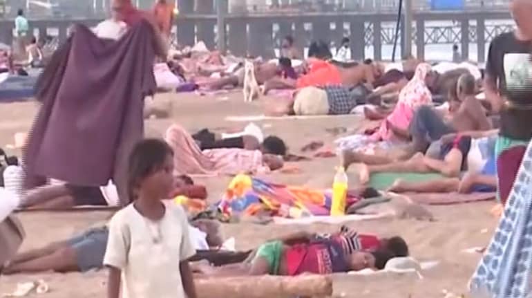 Mumbai monsoon is still far away, forcing residents to sleep on Versova ...
